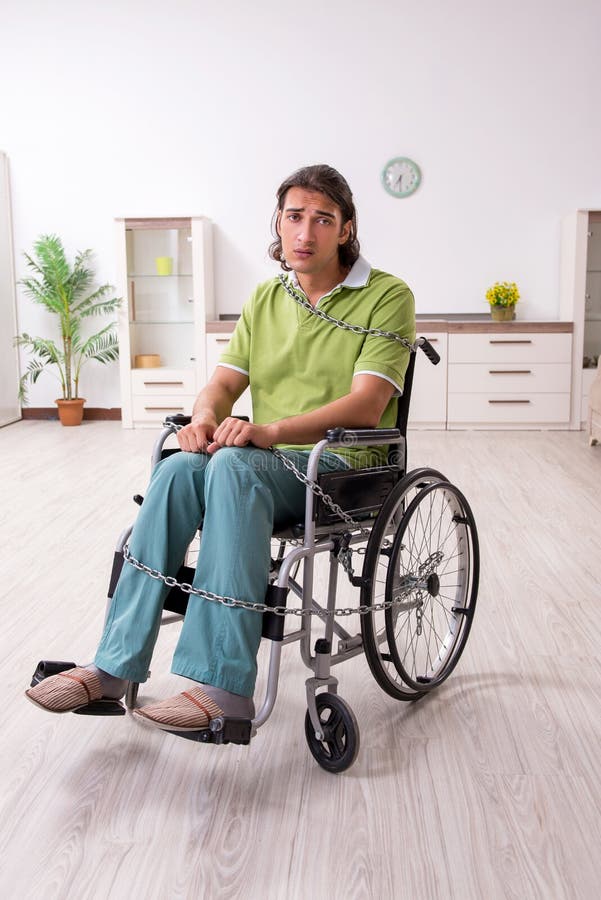 Young Male Invalid in Wheel-chair Suffering at Home Stock Image - Image ...