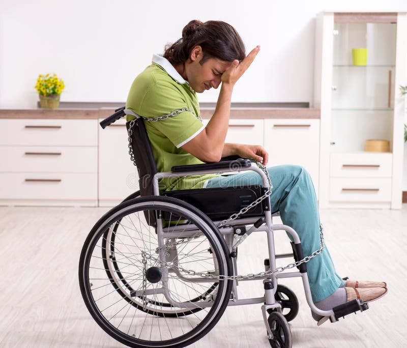 Young Male Invalid in Wheel-chair Suffering at Home Stock Image - Image ...