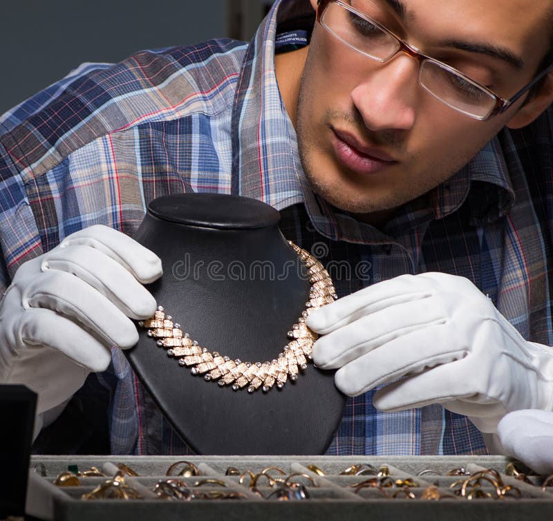 Young Male Jeweller Working at Night in His Workshop Stock Image ...