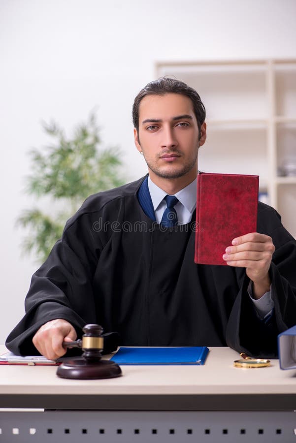 Young Male Judge Working in Courthouse Stock Photo - Image of book ...