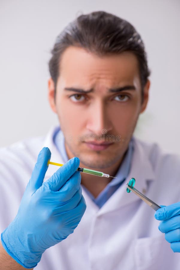 Young Male Lab Assistant in Drug Synthesis Concept Stock Photo - Image ...