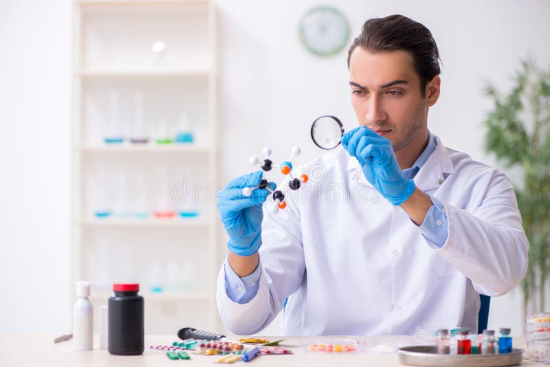Young Male Lab Assistant in Drug Synthesis Concept Stock Photo - Image ...