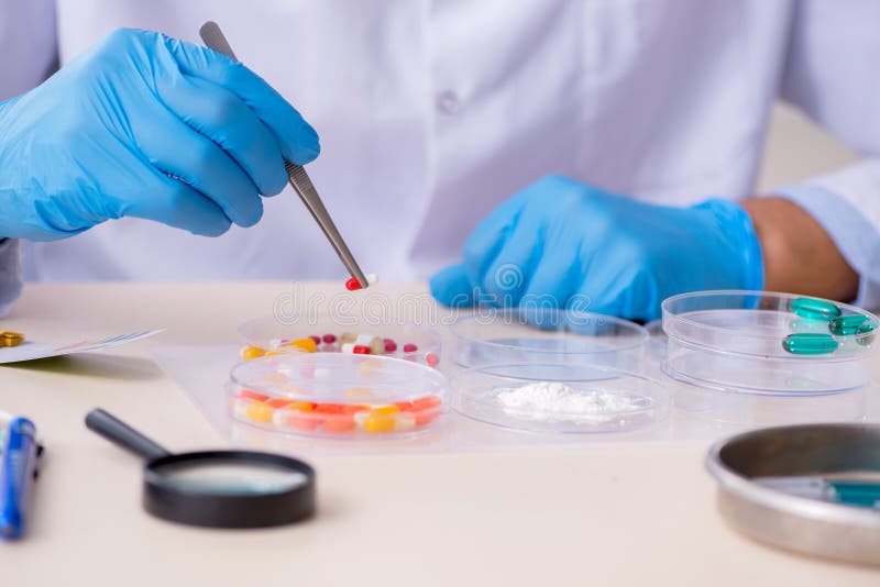 Young Male Lab Assistant in Drug Synthesis Concept Stock Image - Image ...