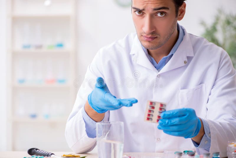 Young Male Lab Assistant in Drug Synthesis Concept Stock Image - Image ...