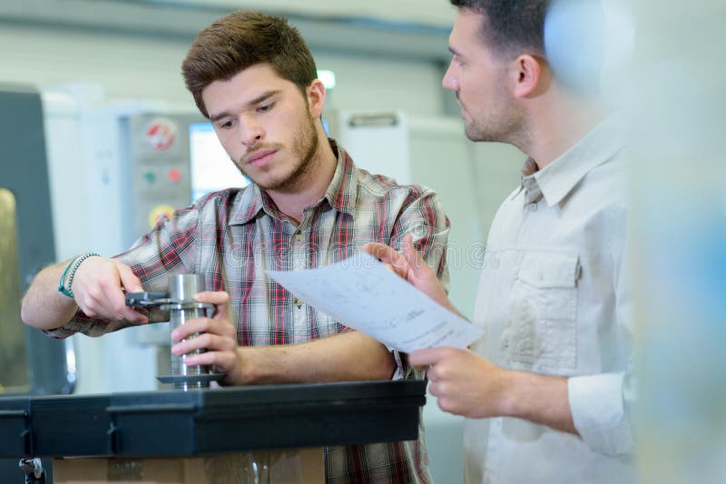 Young Male Machine Engineering Student Supervised by Teacher Stock ...