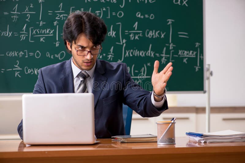 The Young Male Math Teacher in Classroom Stock Image - Image of ...