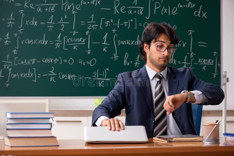 The Young Male Math Teacher in Classroom Stock Photo - Image of looking ...