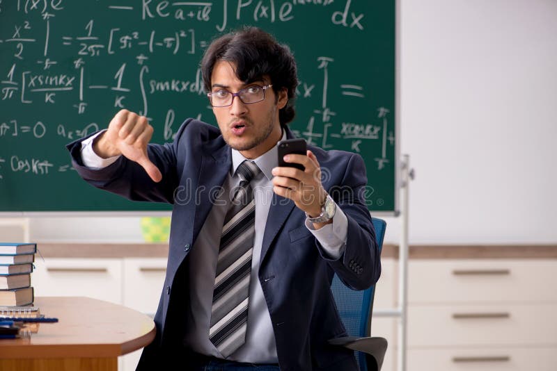 The Young Male Math Teacher in Classroom Stock Image - Image of ...