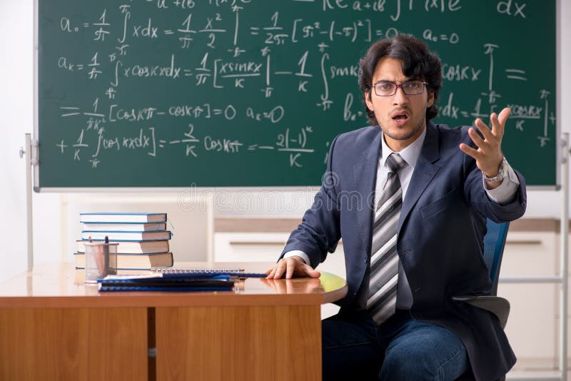 The Young Male Math Teacher in Classroom Stock Photo - Image of ...