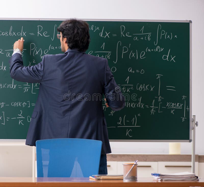 Young Male Math Teacher in Classroom Stock Image - Image of education ...