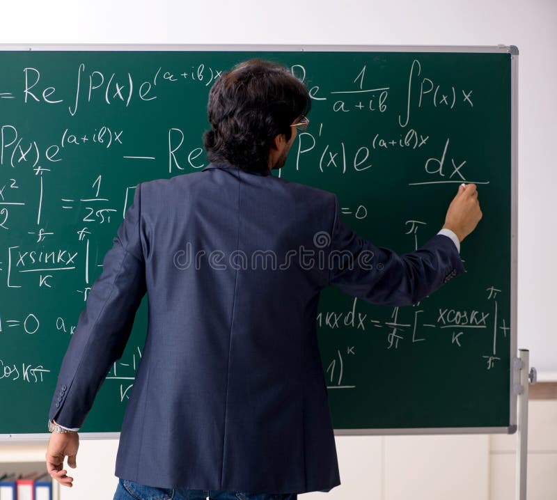 Young Male Math Teacher in Classroom Stock Image - Image of explaining ...