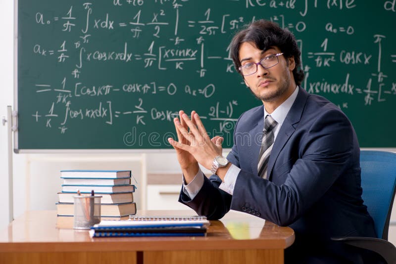 The Young Male Math Teacher in Classroom Stock Image - Image of ...