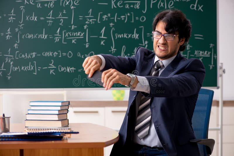 The Young Male Math Teacher in Classroom Stock Image - Image of ...