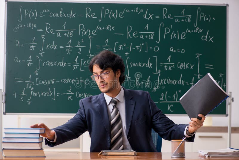 The Young Male Math Teacher in Classroom Stock Image - Image of ...