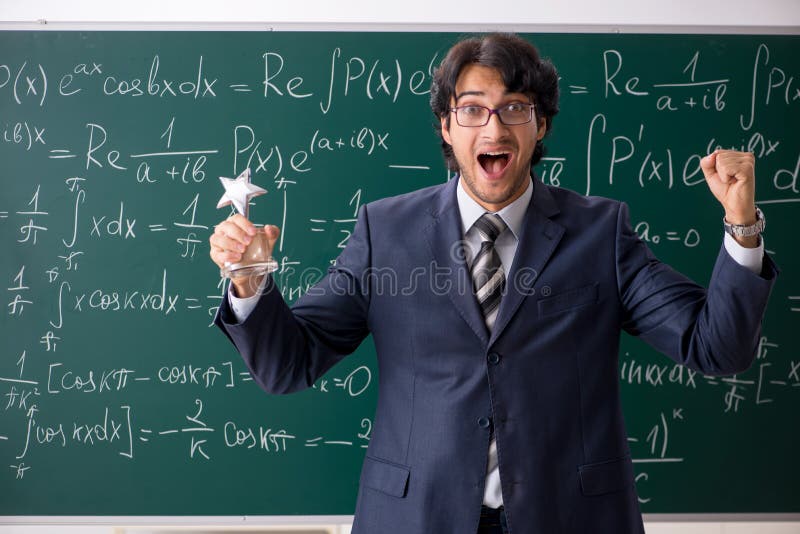 The Young Male Math Teacher in Classroom Stock Photo - Image of month ...