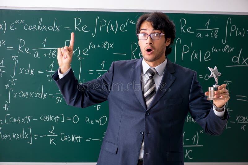 The Young Male Math Teacher in Classroom Stock Image - Image of ...