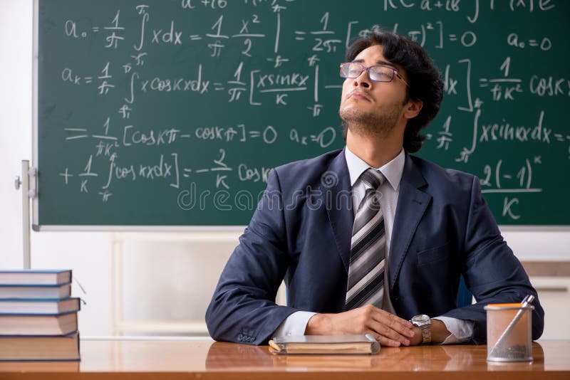 The Young Male Math Teacher in Classroom Stock Image - Image of board ...