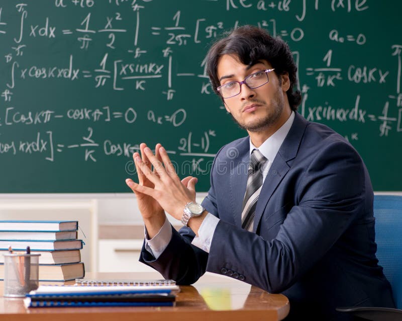 Young Male Math Teacher in Classroom Stock Photo - Image of equation ...