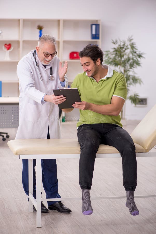 Young Male Patient Visiting Old Male Doctor Stock Image - Image of ...