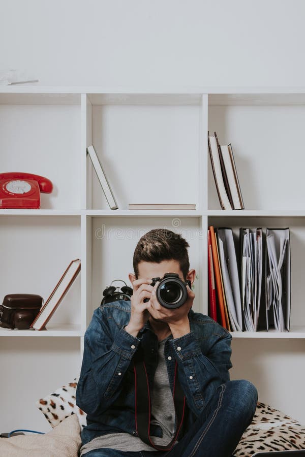 Young male photographer stock image. Image of room, digital - 82124069