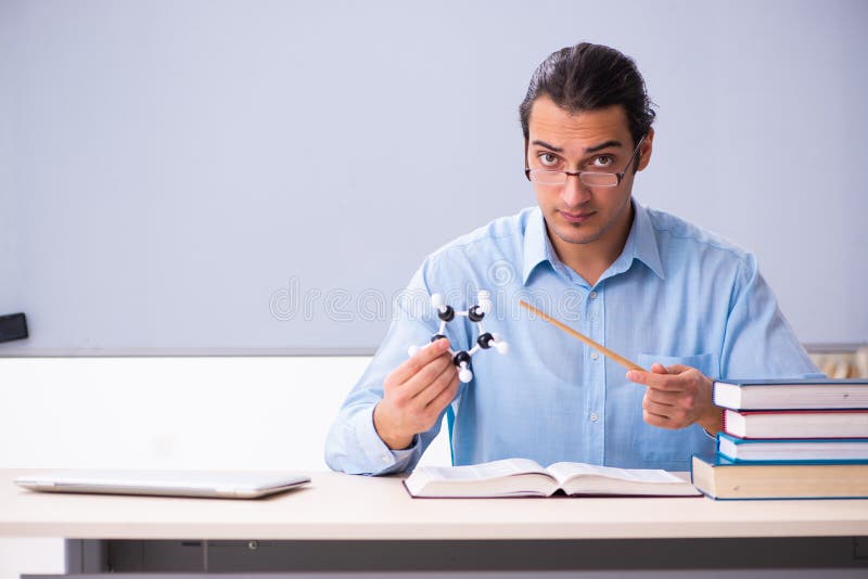 Young Male Physics Teacher in Front of Whiteboard Stock Image - Image ...