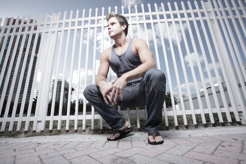 Young Male Posing by a Fence Stock Photo - Image of look, pleased: 13079658
