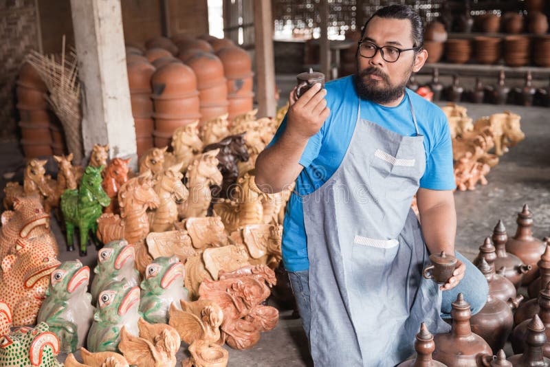 Pottery Maker Looking at Product Stock Photo - Image of clay, preparing ...