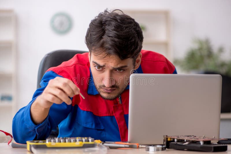 Young Male Repairman Repairing Computer Stock Image - Image of ...