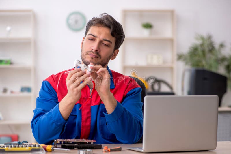 Young Male Repairman Repairing Computer Stock Image - Image of young ...