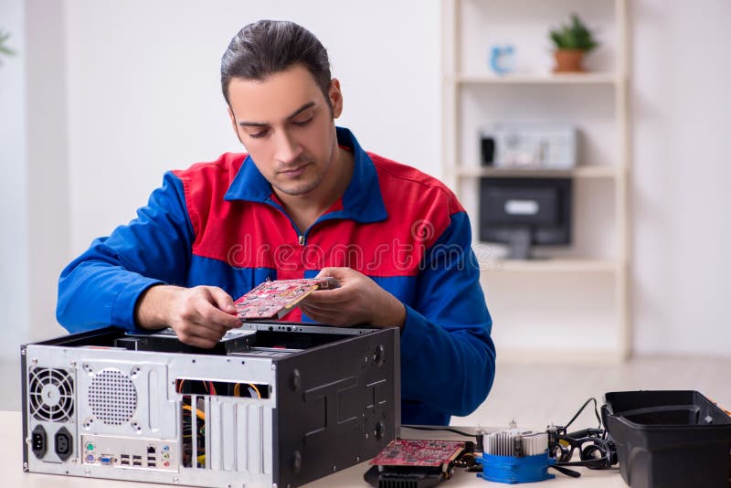 Young Male Repairman Repairing Computer Stock Photo - Image of parts ...