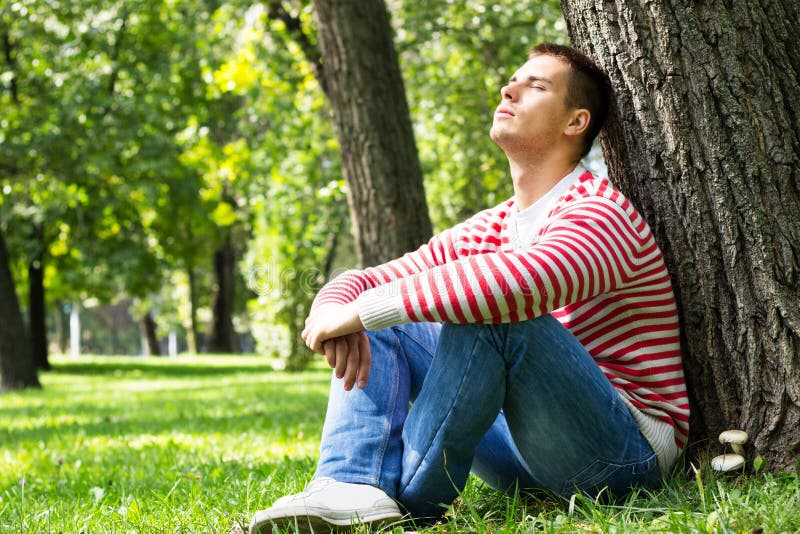 Young Male Resting in the Park Stock Photo - Image of face ...