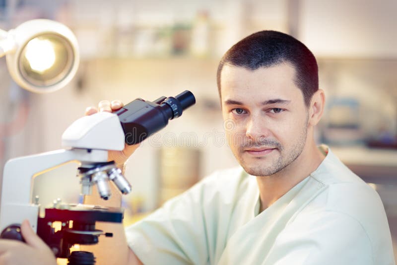 Young Male Scientist with Microscope Stock Photo - Image of expert ...