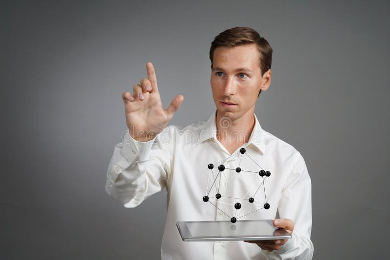 Young Male Scientist Working with a Model of the Atom. Stock Photo ...