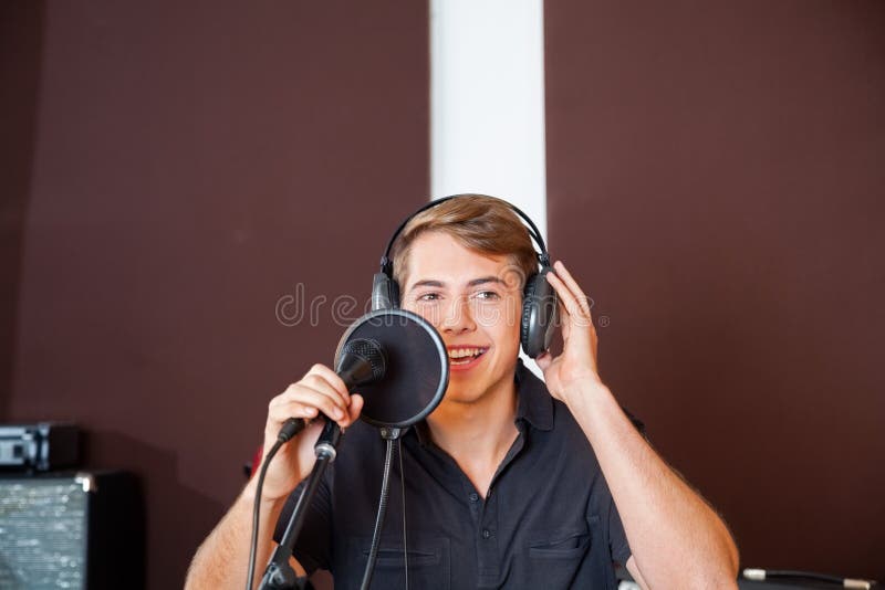 Handsome Male Singer Performing in Studio Stock Photo - Image of band ...
