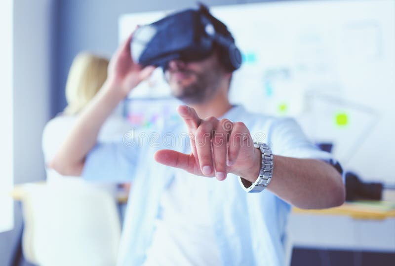 Young Male Software Programmer Testing a New App with 3d Virtual ...