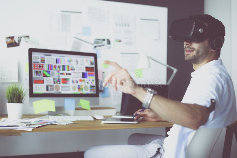 Young Male Software Programmer Testing a New App with 3d Virtual ...