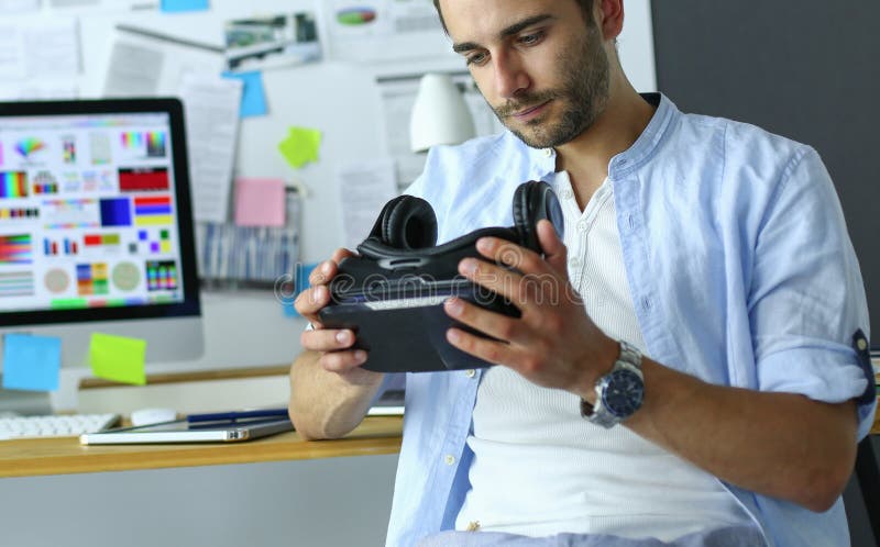 Young Male Software Programmer Testing a New App with 3d Virtual ...