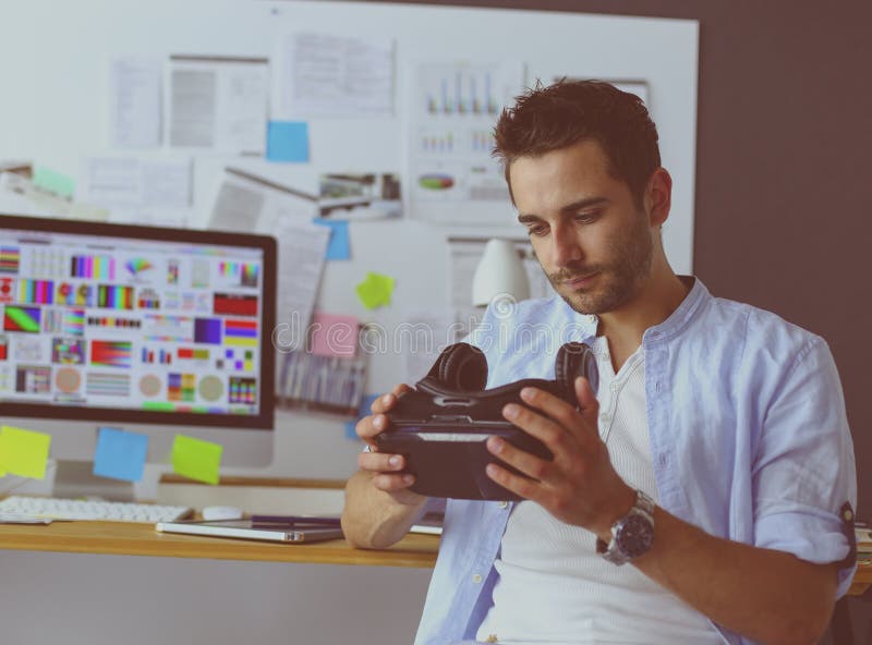 Young Male Software Programmer Testing a New App with 3d Virtual ...