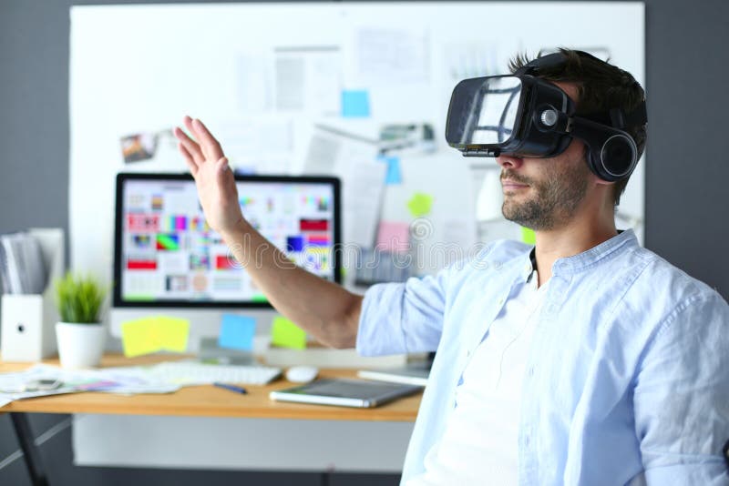 Young Male Software Programmer Testing a New App with 3d Virtual ...