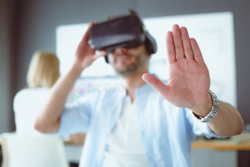 Young Male Software Programmer Testing a New App with 3d Virtual ...
