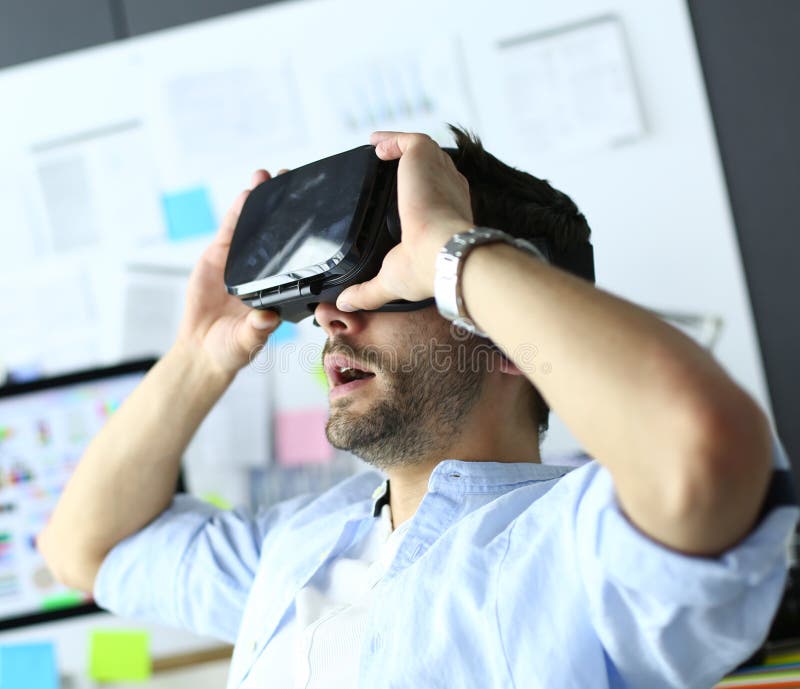 Young Male Software Programmer Testing a New App with 3d Virtual ...