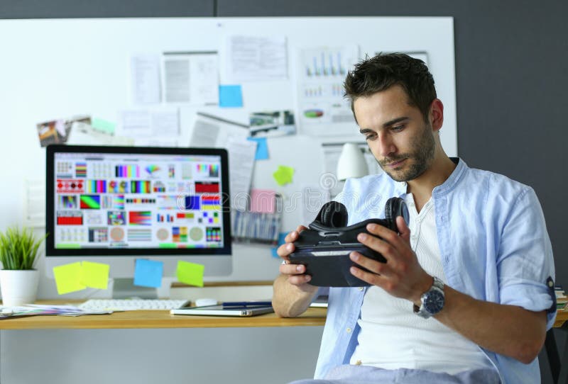 Young Male Software Programmer Testing a New App with 3d Virtual ...