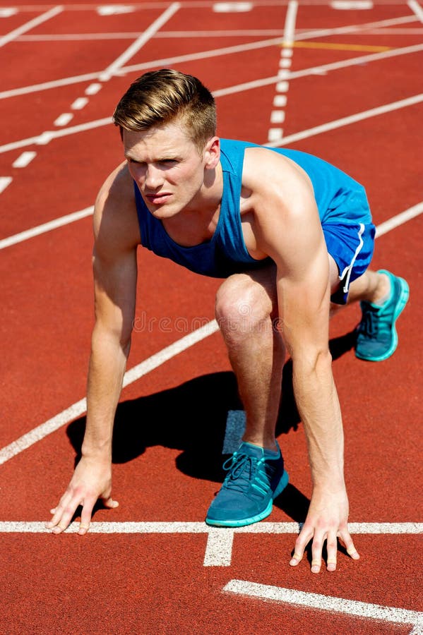 Young Male Sprinter in Starting Blocks Stock Image - Image of olympics ...