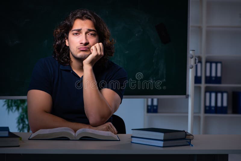 Young Male Student in the Classroom at Night Stock Photo - Image of ...