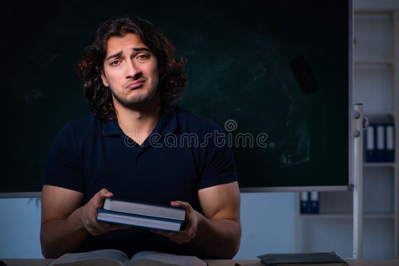 Young Male Student in the Classroom at Night Stock Photo - Image of ...