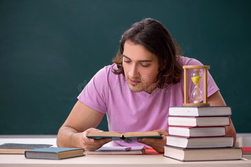 Young Male Student in the Classroom at Time Management Concept Stock ...