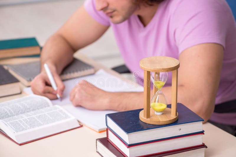 Young Male Student in the Classroom at Time Management Concept Stock ...