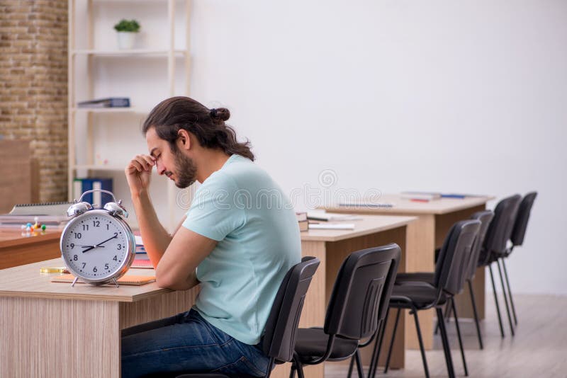 Young Male Student in the Classroom in Time Management Concept Stock ...