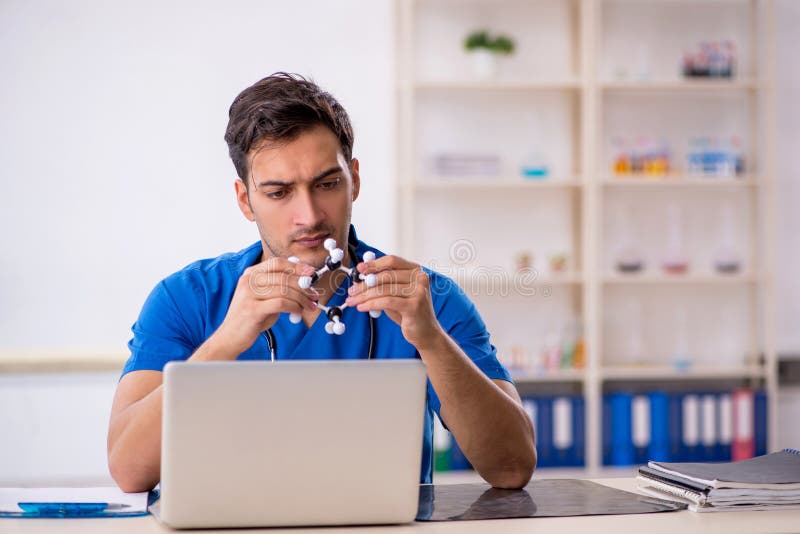 Young Male Student Doctor Holding Molecular Model Stock Image - Image ...