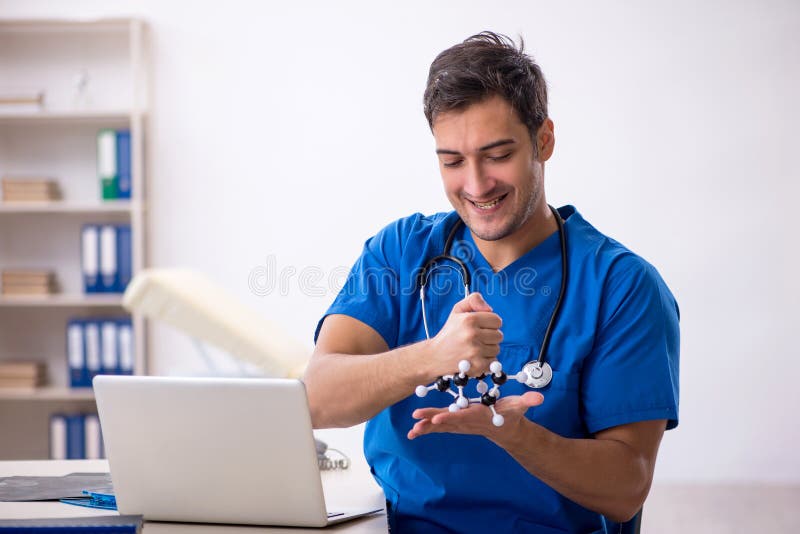 Young Male Student Doctor Holding Molecular Model Stock Photo - Image ...